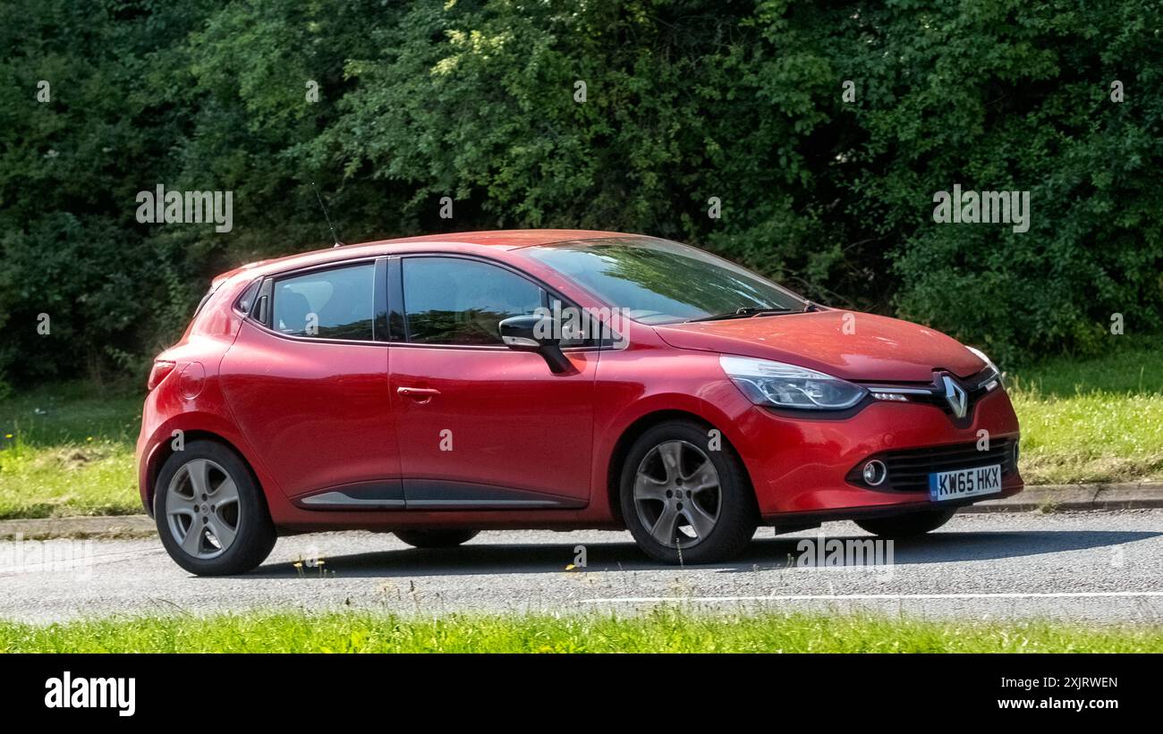 Milton Keynes,UK - July 18th 2024: 2015 red Renault Clio car driving on ...