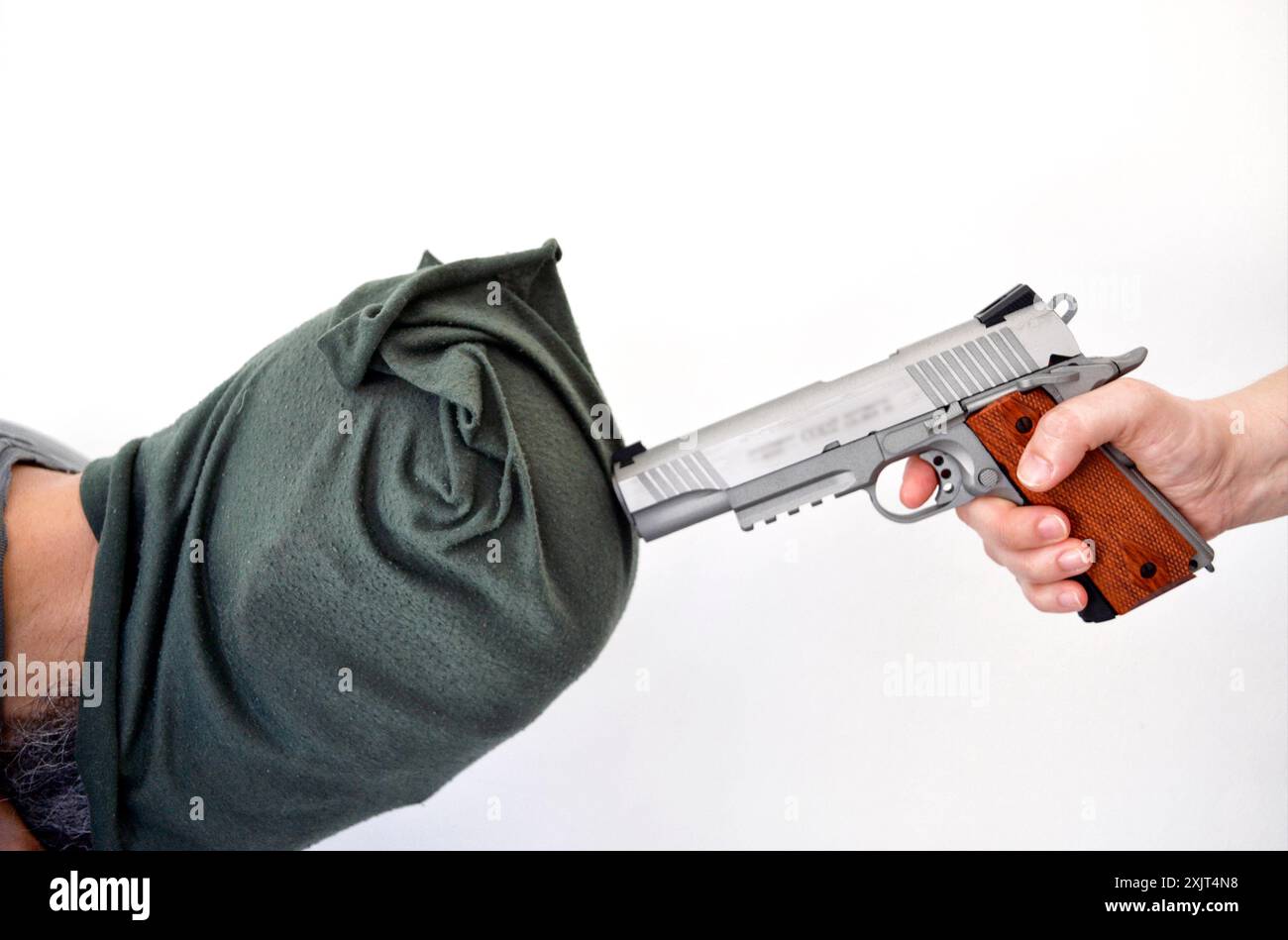 A man is tied up hooded and threatened with death with a gun over his ...