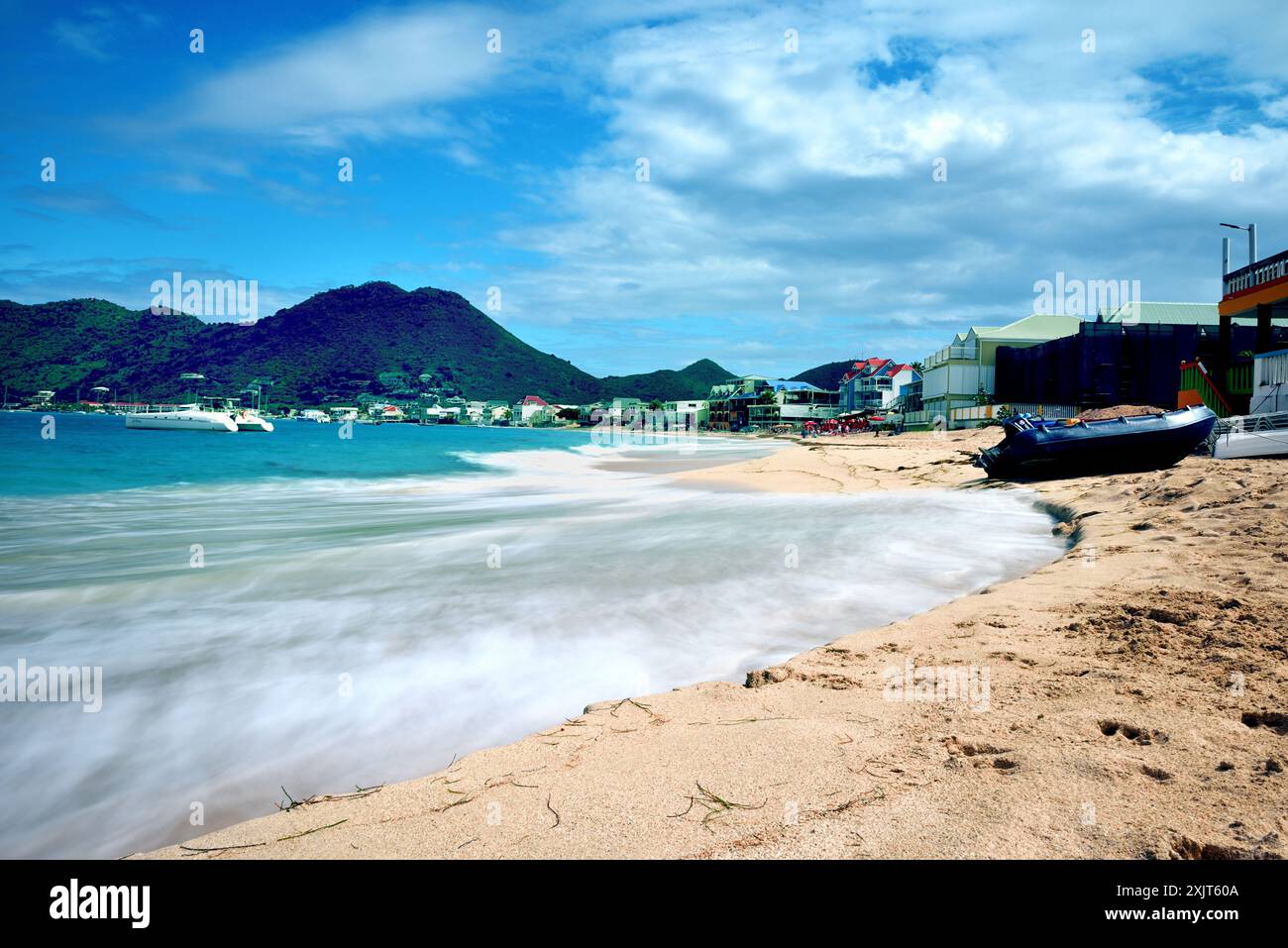 Orient Bay, St Maarten - 2nd February 2024:The curved sea front of ...