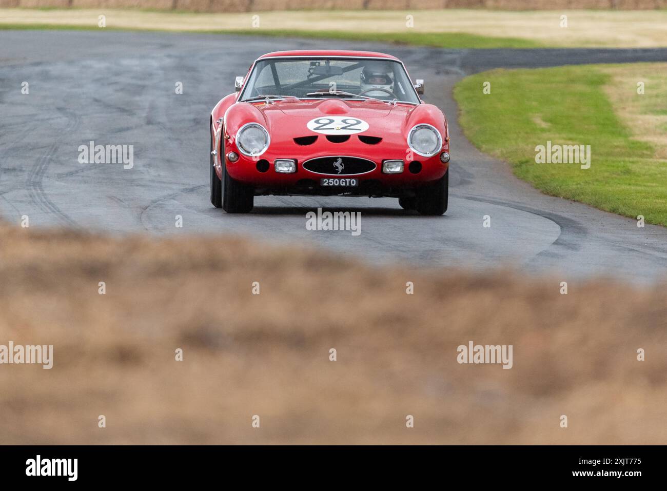 1962 Ferrari 250 GTO race car of Ten Tenths Ltd driving up the hill ...