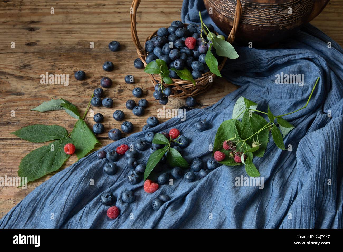 Still life with blueberries and raspberry Stock Photo - Alamy