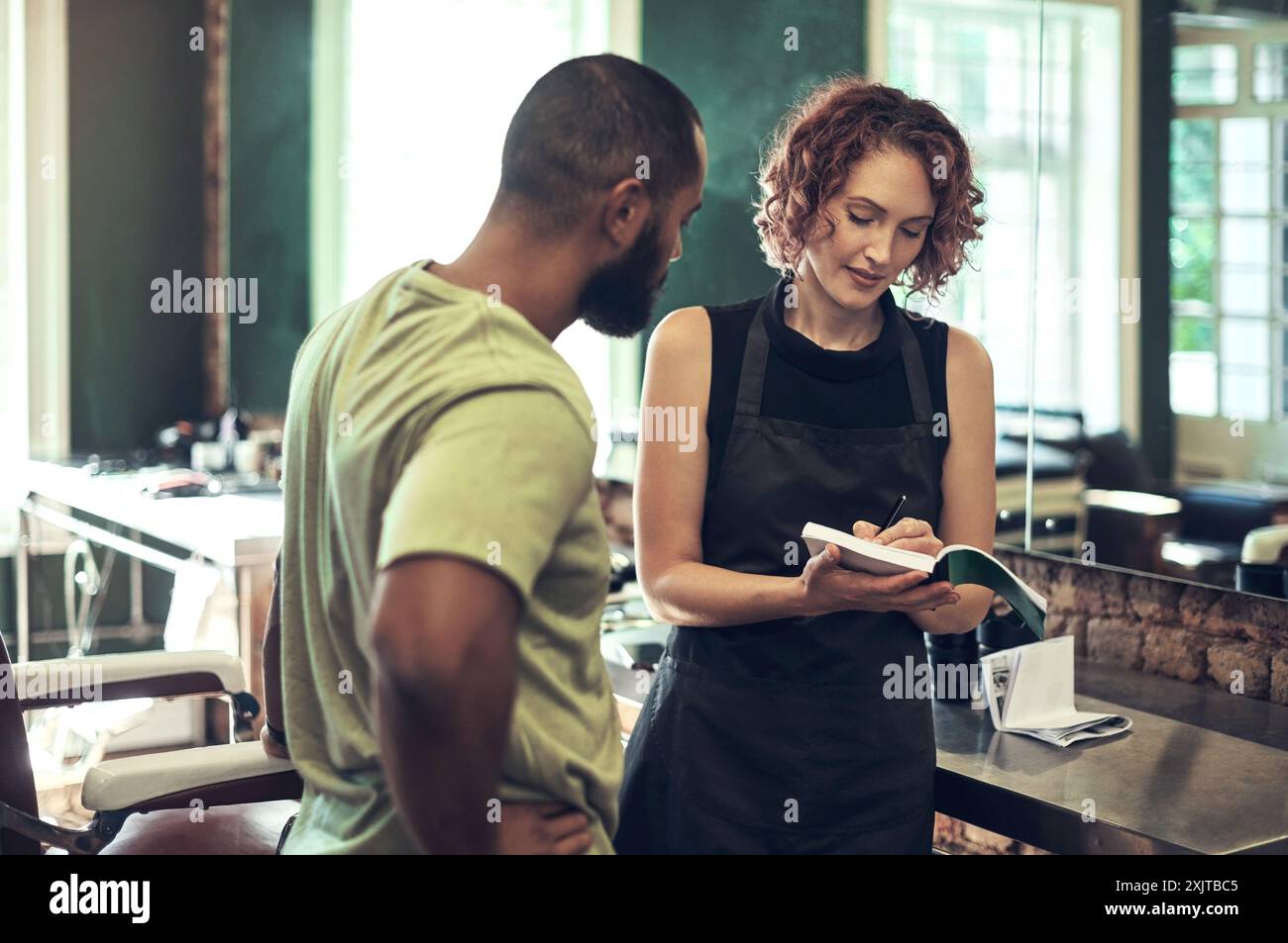 Man writing in bill book hi-res stock photography and images - Alamy