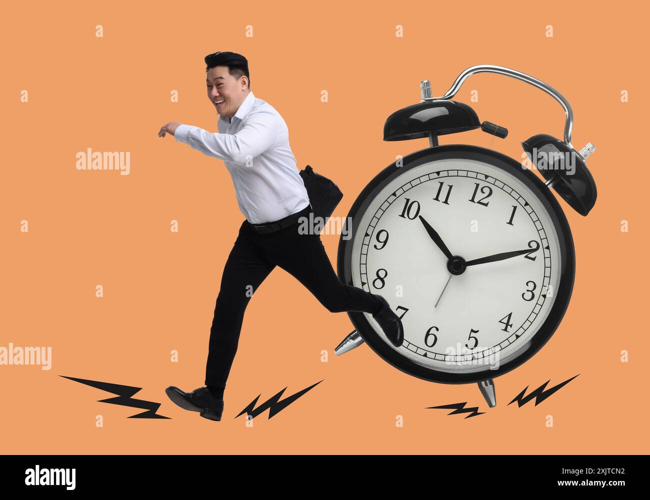 Businessman running away from alarm clock on dark beige background ...