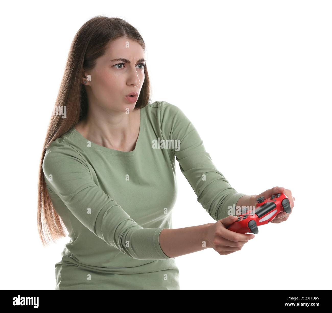 Surprised woman playing video games with controller on white background ...