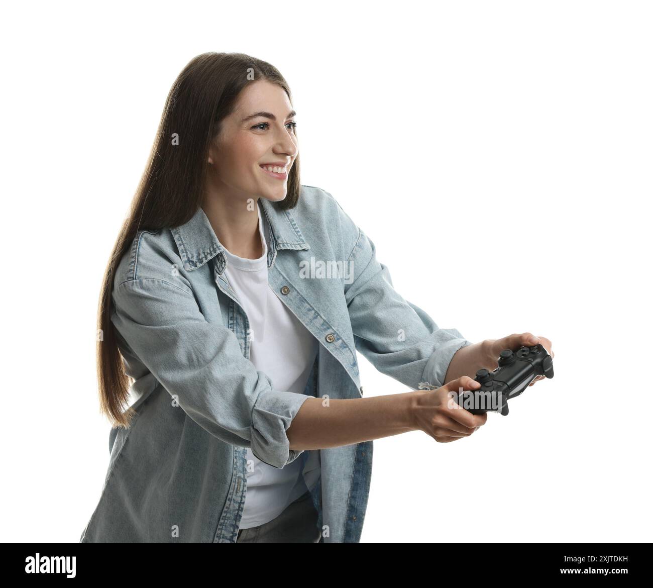 Happy woman playing video games with controller on white background ...