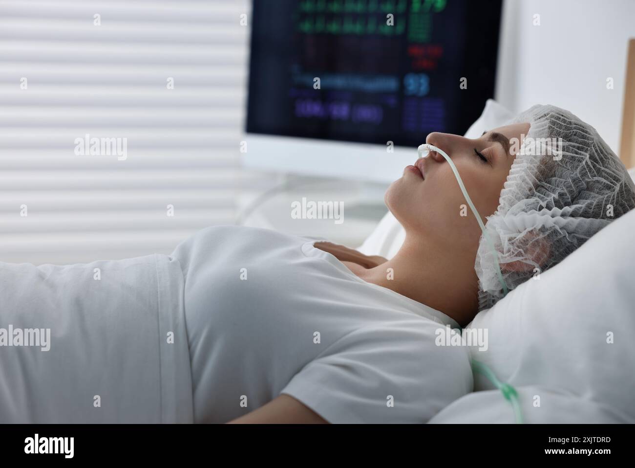 Coma patient. Young woman sleeping in hospital bed Stock Photo - Alamy