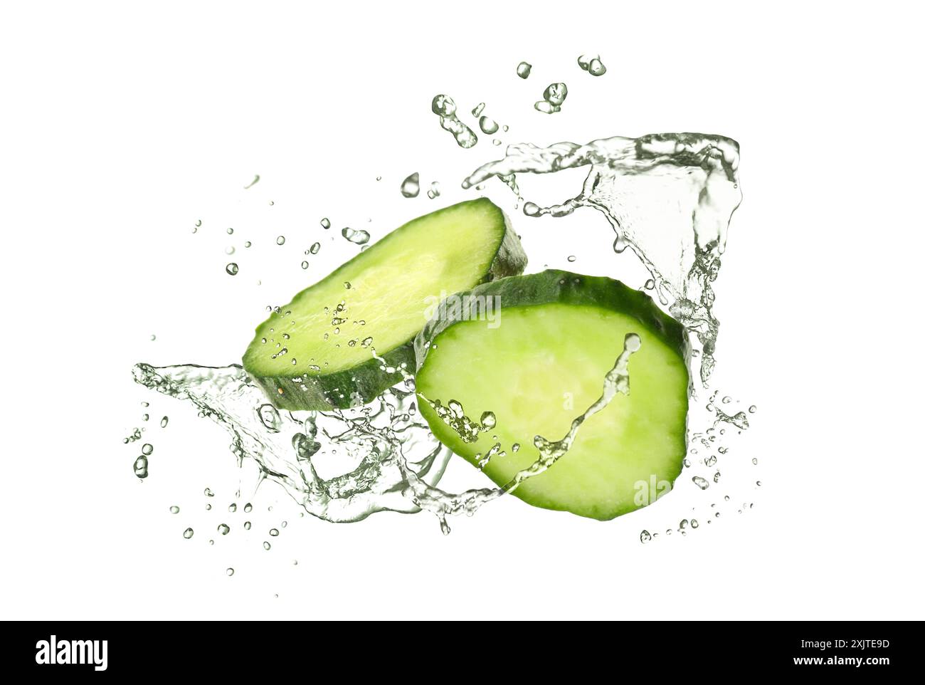 Cucumber slices and splashing water in air on white background Stock ...