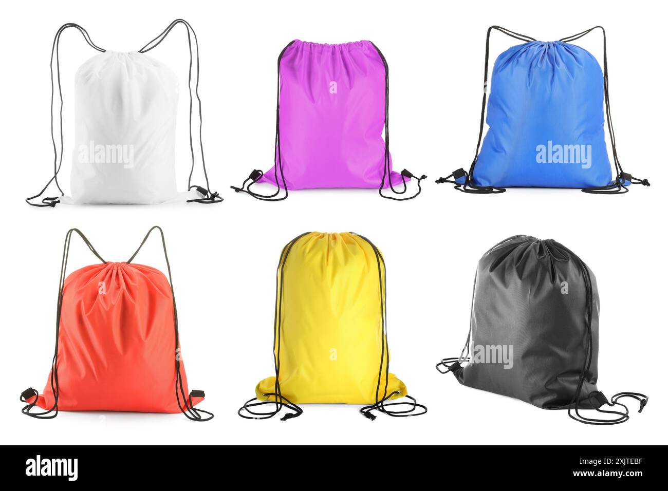 Many filled drawstring bags of different colors isolated on white, set ...