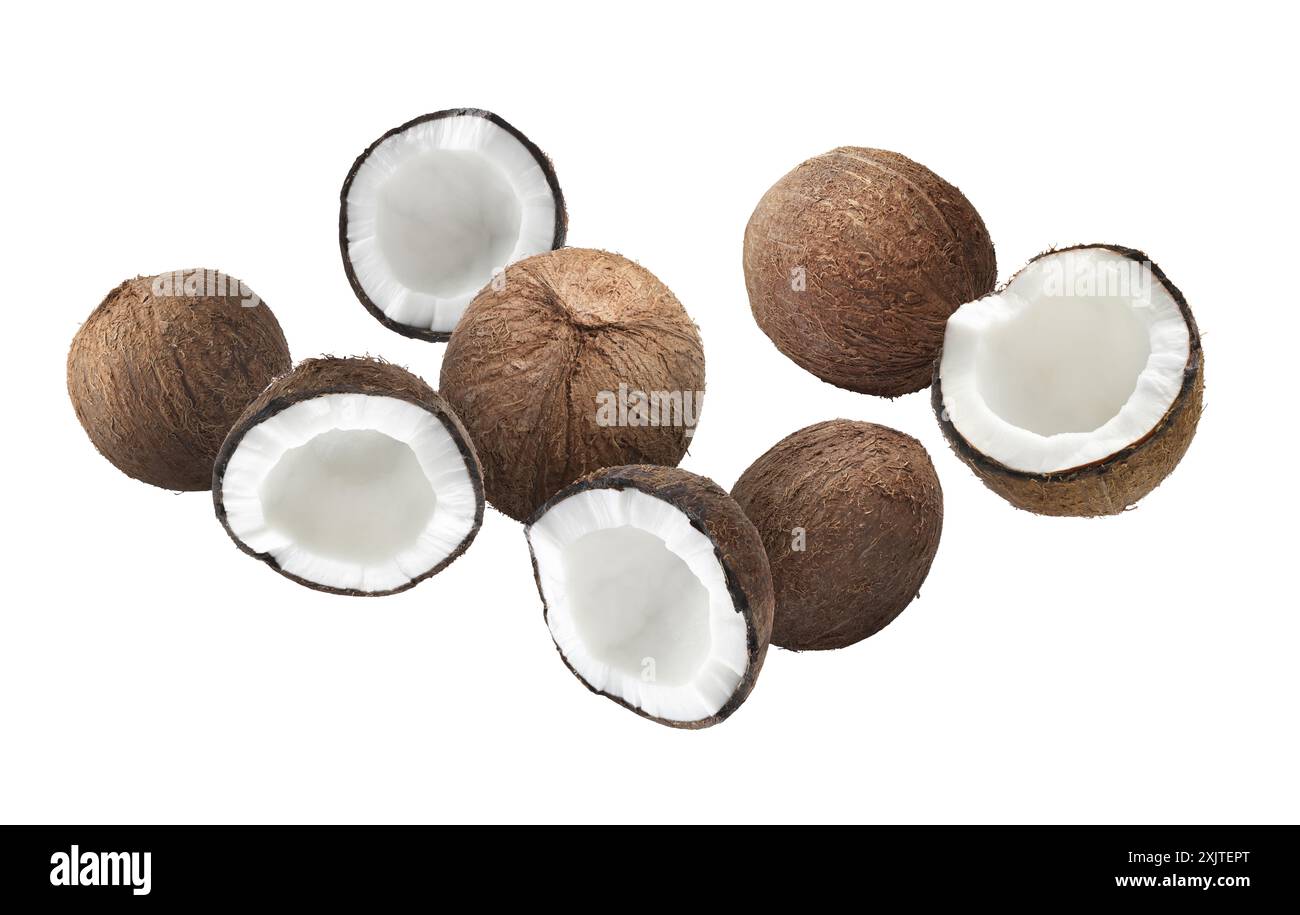 Many coconuts in air on white background Stock Photo - Alamy
