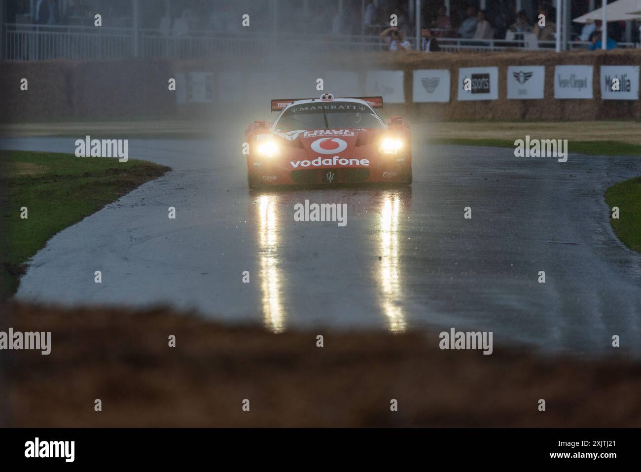 2005 Maserati MC12 GT1 FIA GT race car driving up the hill climb track at the Goodwood Festival ...
