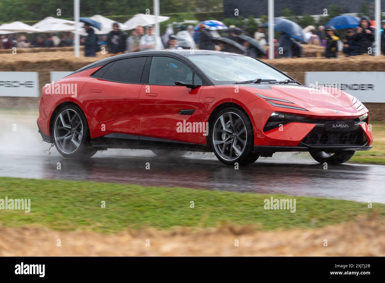 2024 Lotus Emeya R electric car driving up the hill climb track at the ...