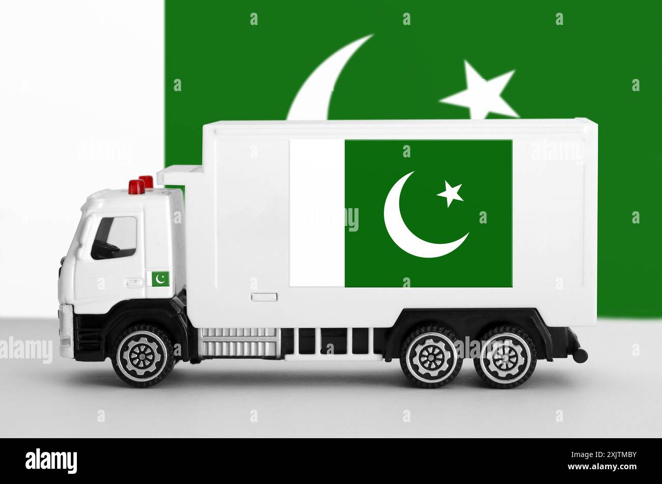 Pakistan flag depicted on side wall of white delivery van close up ...