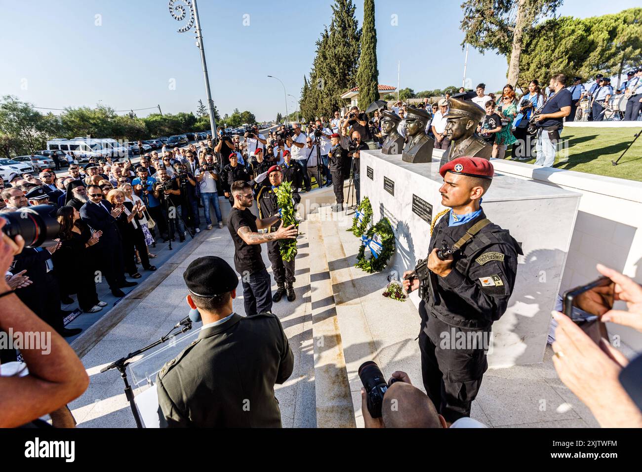 Cyprus : 50th invasion anniversary memorial A man puts a wreath on the ...