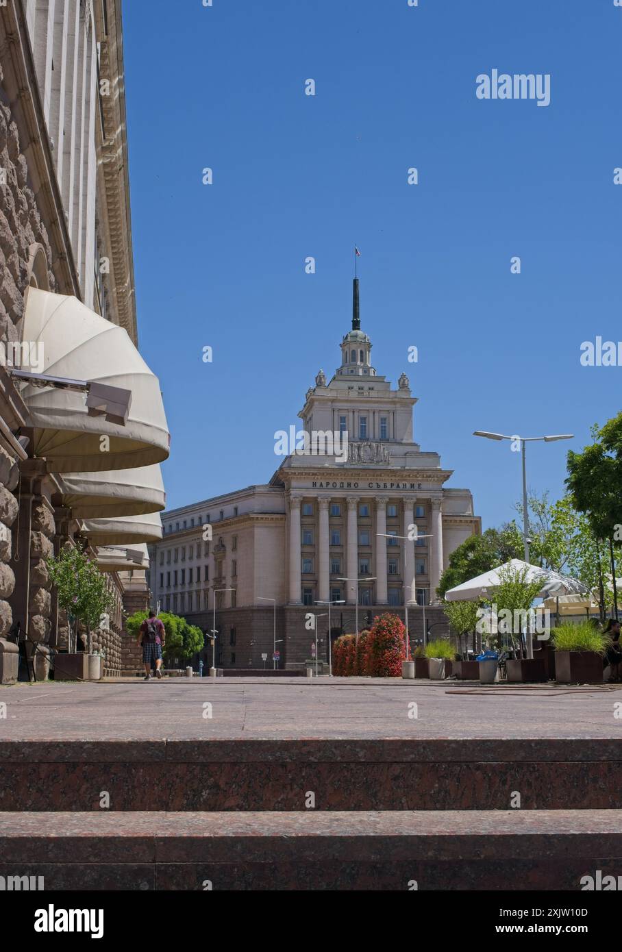 Sofia, Bulgaria - Jul 7, 2024: Sofia National Assembly of Bulgaria. People walking in Ancient ...