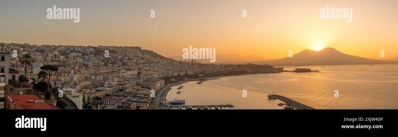 Panorama of the Gulf of Naples in Italy with the sun rising right ...