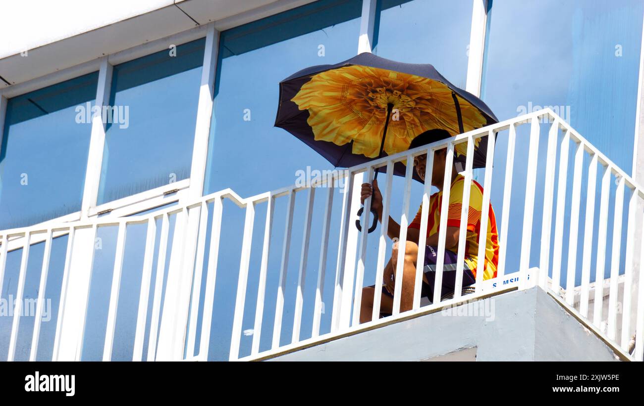 People on the balcony a with white building Stock Photo - Alamy