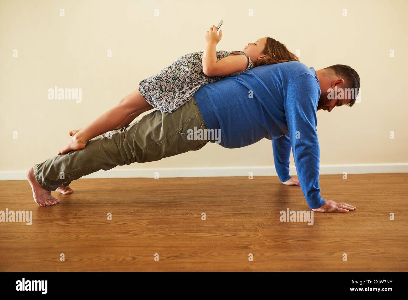 Child, father and push ups on back in home for exercise, workout and ...