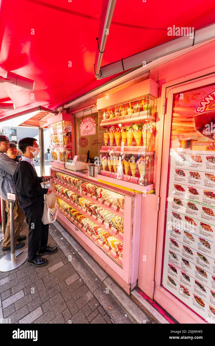 Customers waiting in line to be served at the take away counter of the ...
