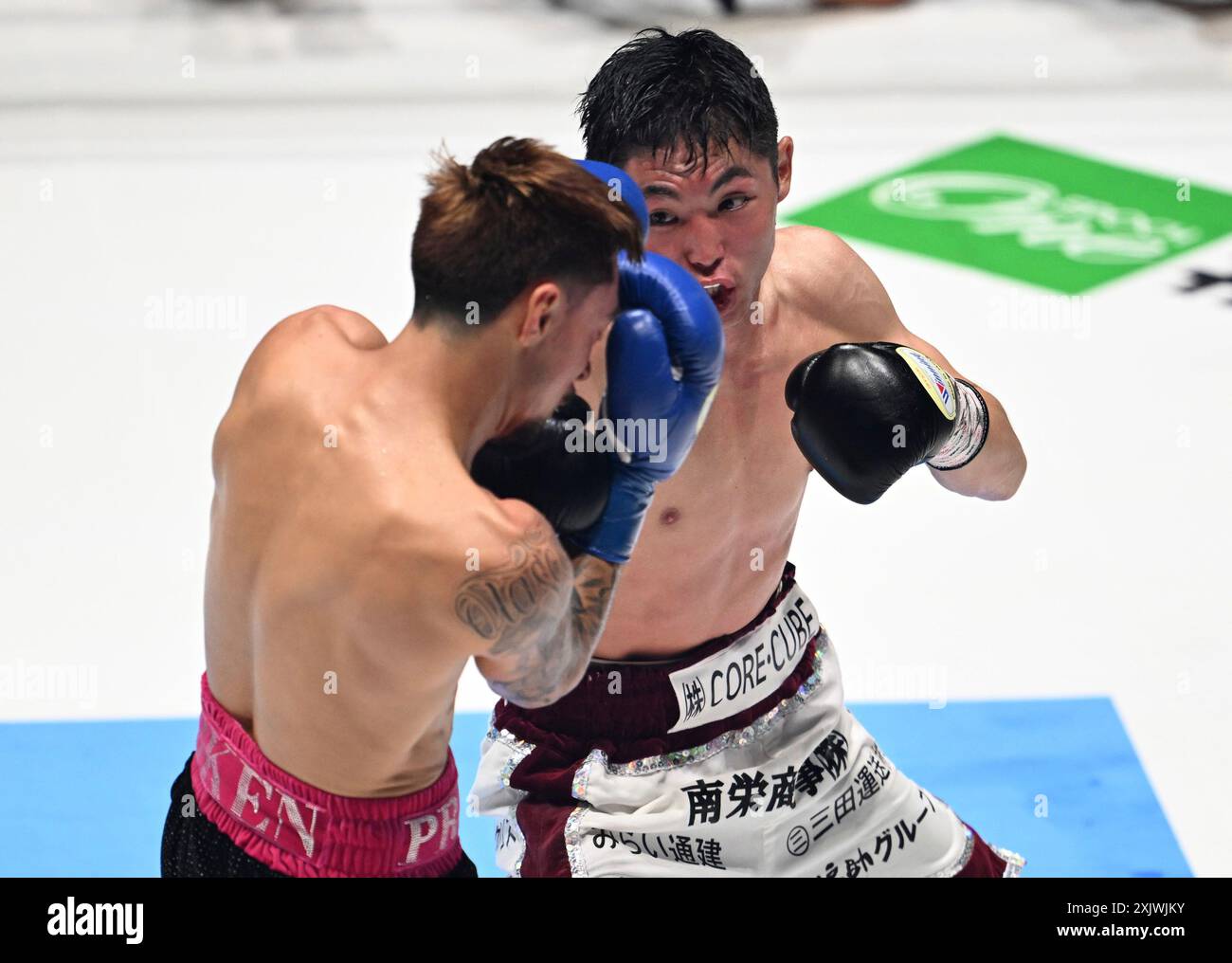 Anthony Olascuaga (L) of the U.S.A. delivers a punch against Japanese ...