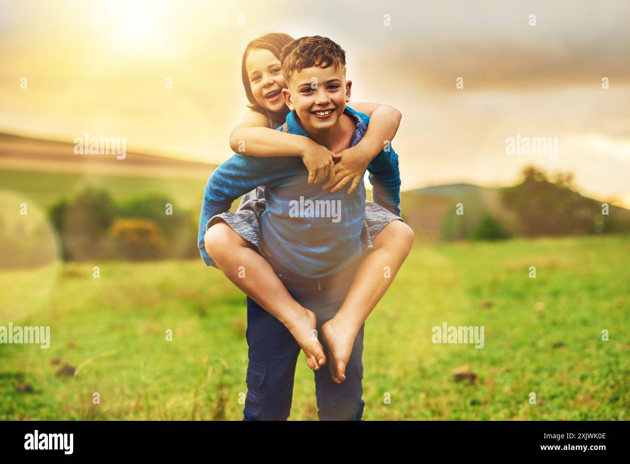 Piggyback, nature and portrait of kids outdoors for bonding, playing ...