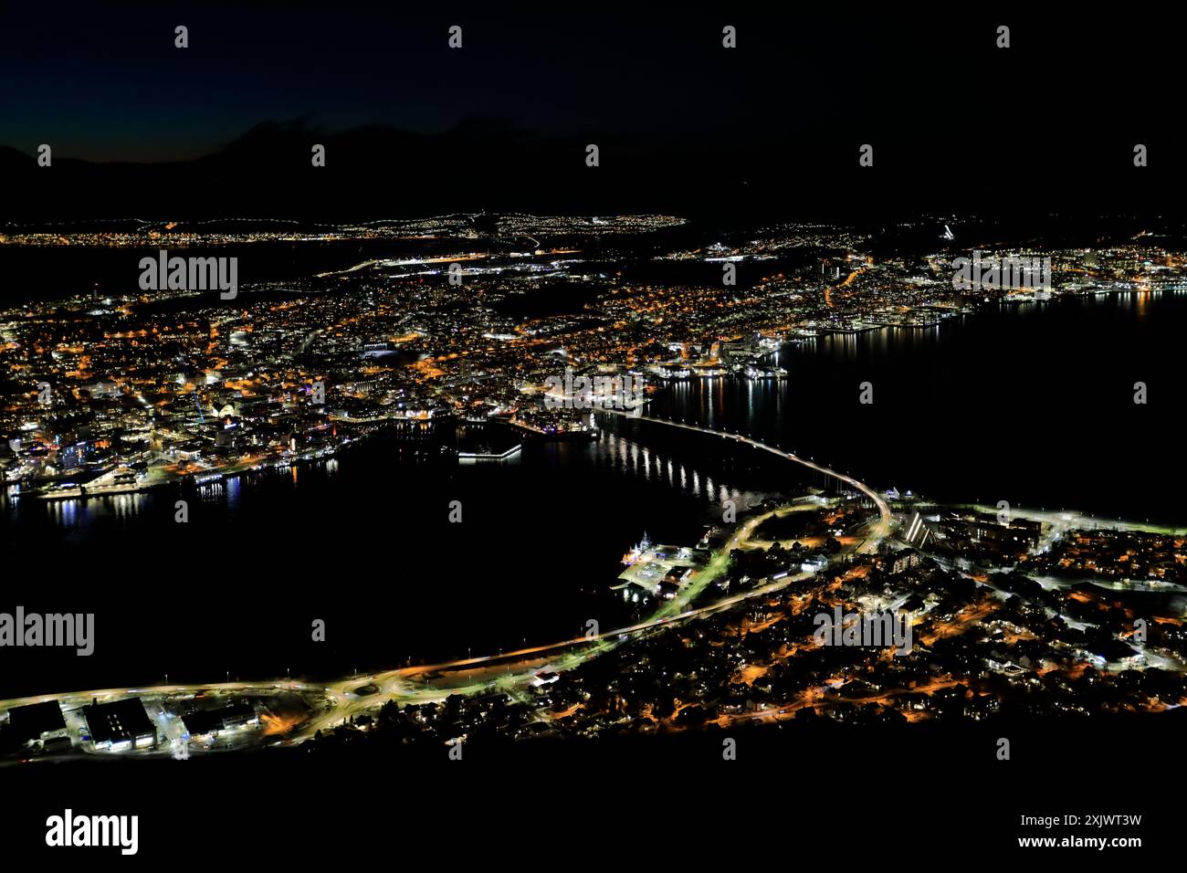 The Northern Lights over Tromso city, Troms county, Norway Stock Photo ...