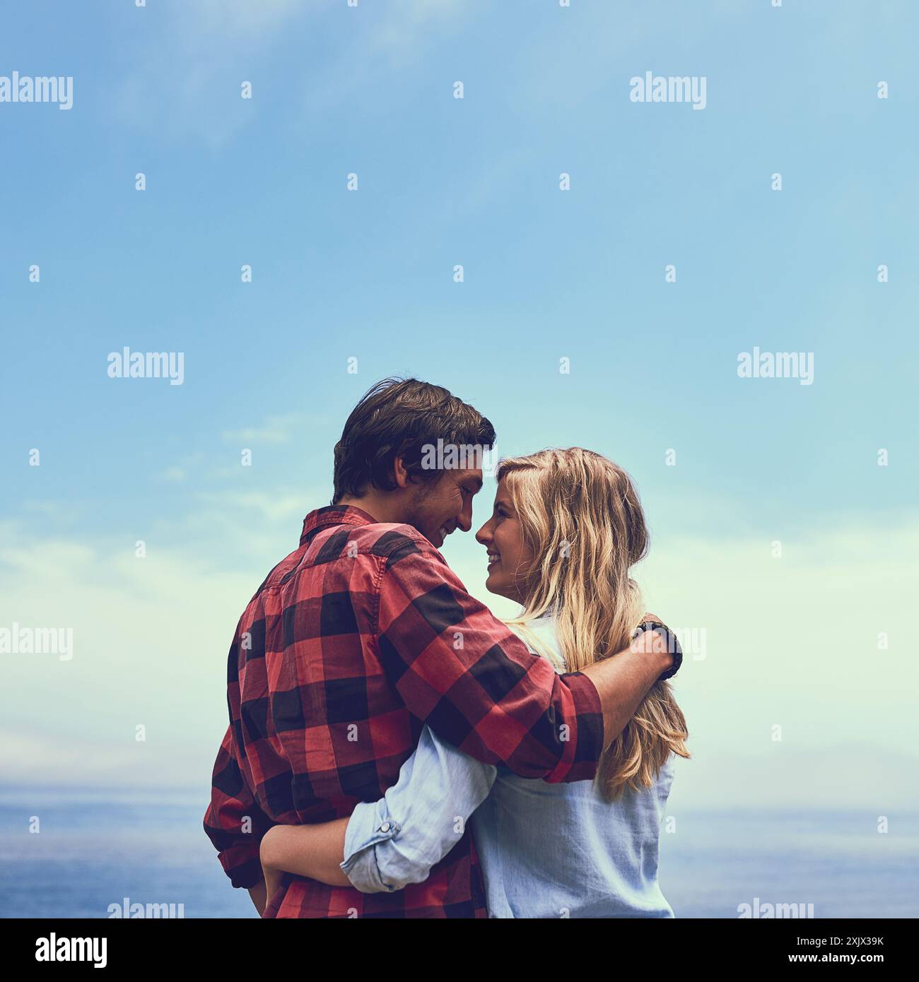 Couple, blue sky and hug for love in nature, hug and embrace for ...