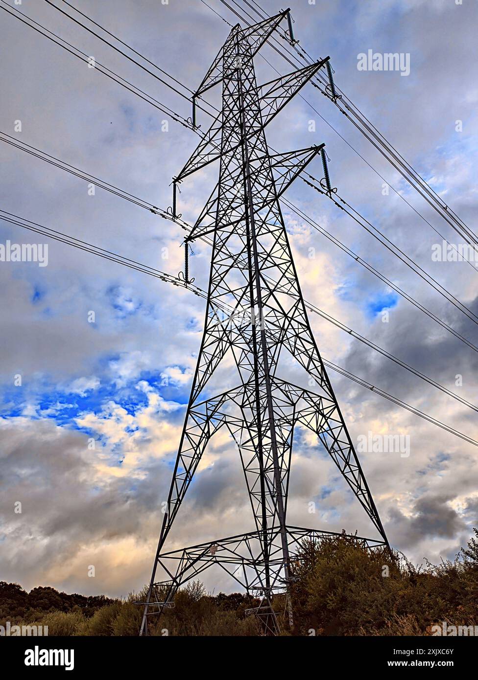 Electricity high voltage pylon in UK at sunset Stock Photo - Alamy