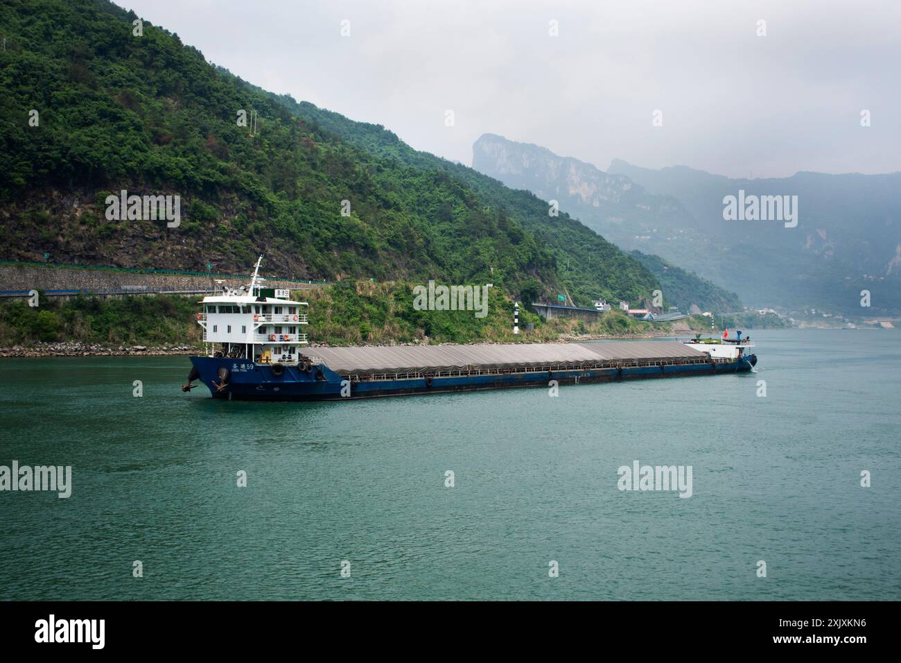 Chinese people drive sail barge boat and tugboat cargo ship delivery ...