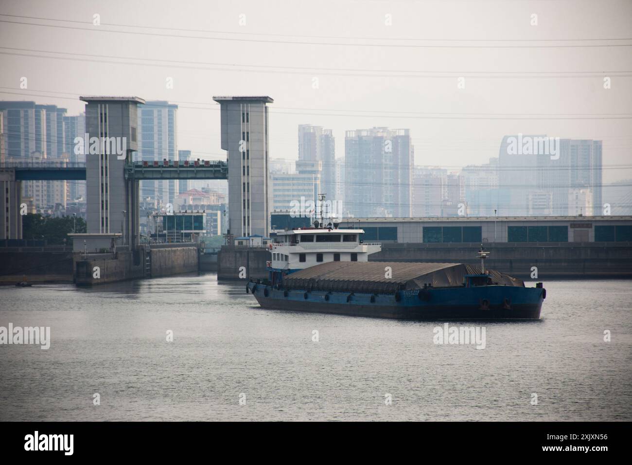 Chinese people drive sail barge and tugboat cargo ship delivery ...