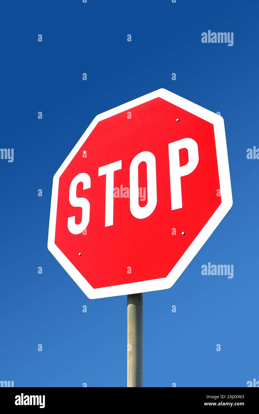 Stop sign in front of blue sky -0075 Stock Photo - Alamy