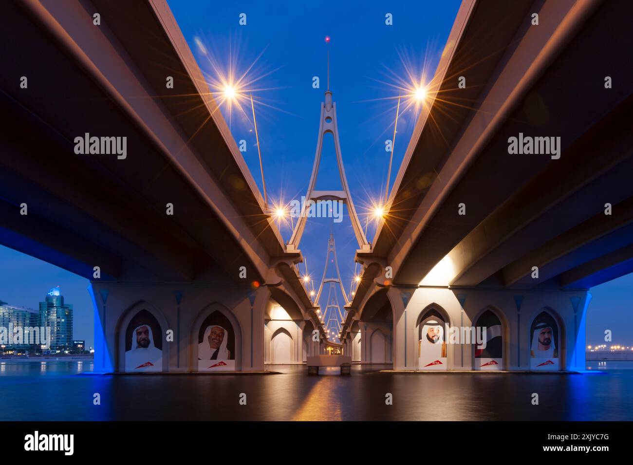 Business Bay Crossing Bridge at sunset with portrait of UAE and Dubai ...