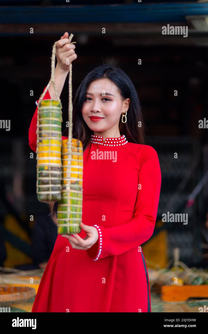 Vietnamese girl with Ao Dai dress sitting in traditional house of ...