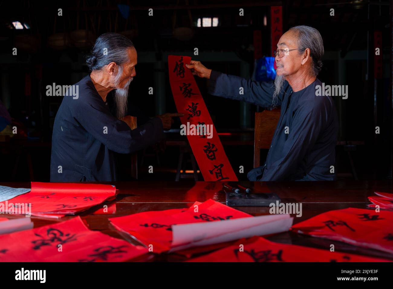 old scholars writing calligraphy at lunar new year. Calligraphy is a ...