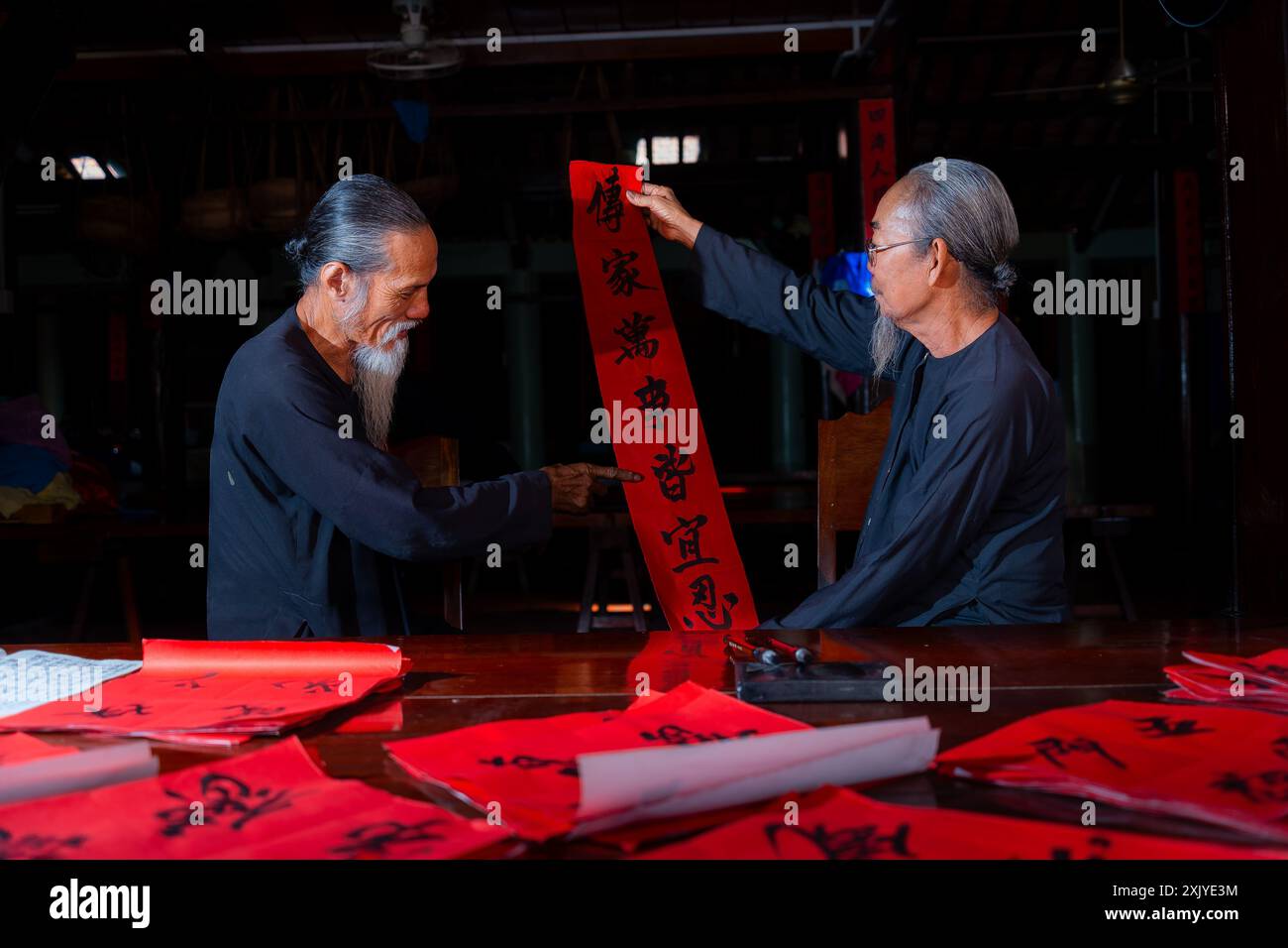 old scholars writing calligraphy at lunar new year. Calligraphy is a ...