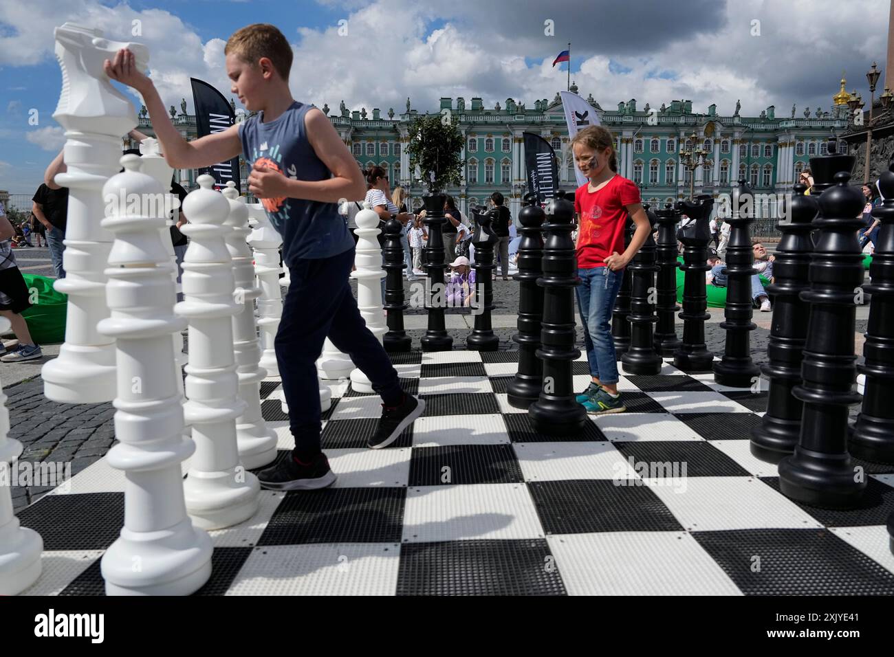 Children play chess during the International Chess Day celebration at ...