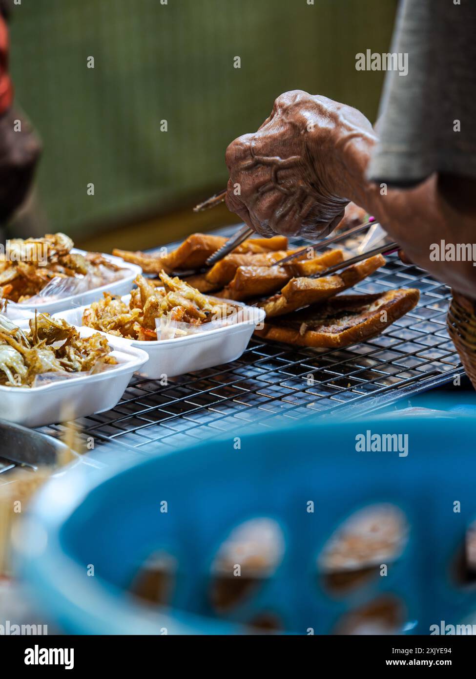 Street Food Vendor Serving Deep Fried Snacks Stock Photo - Alamy