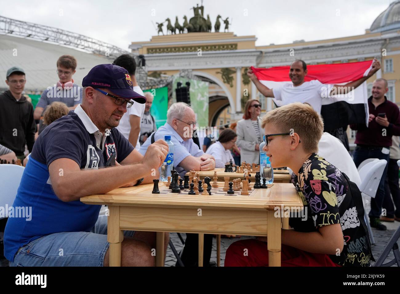 People play chess during the International Chess Day celebration at the ...
