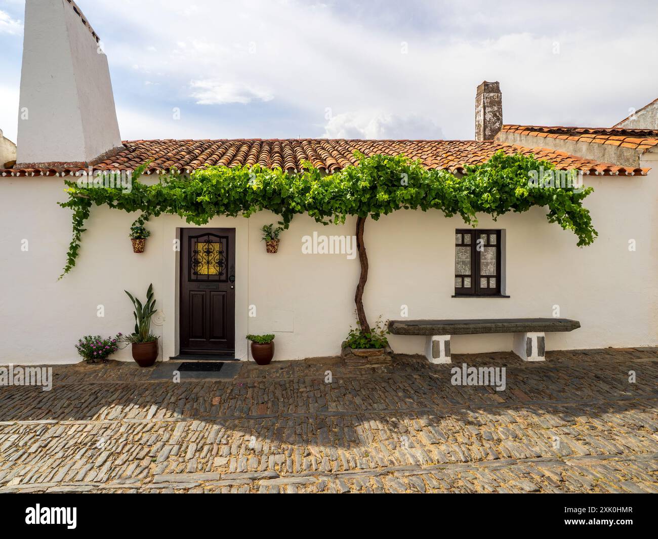 White facades in the medieval village of Monsarrat in the Alentejo of ...