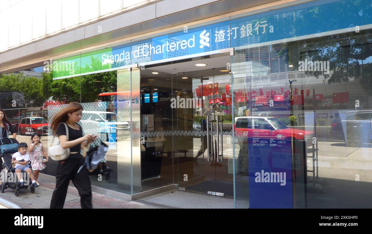 Pedestrians walk past the British multinational bank, Standard ...