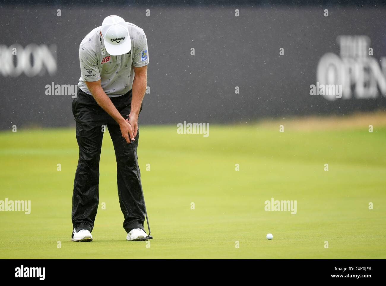 USA's Sam Burns putts on the 18th green during day three of The Open at ...