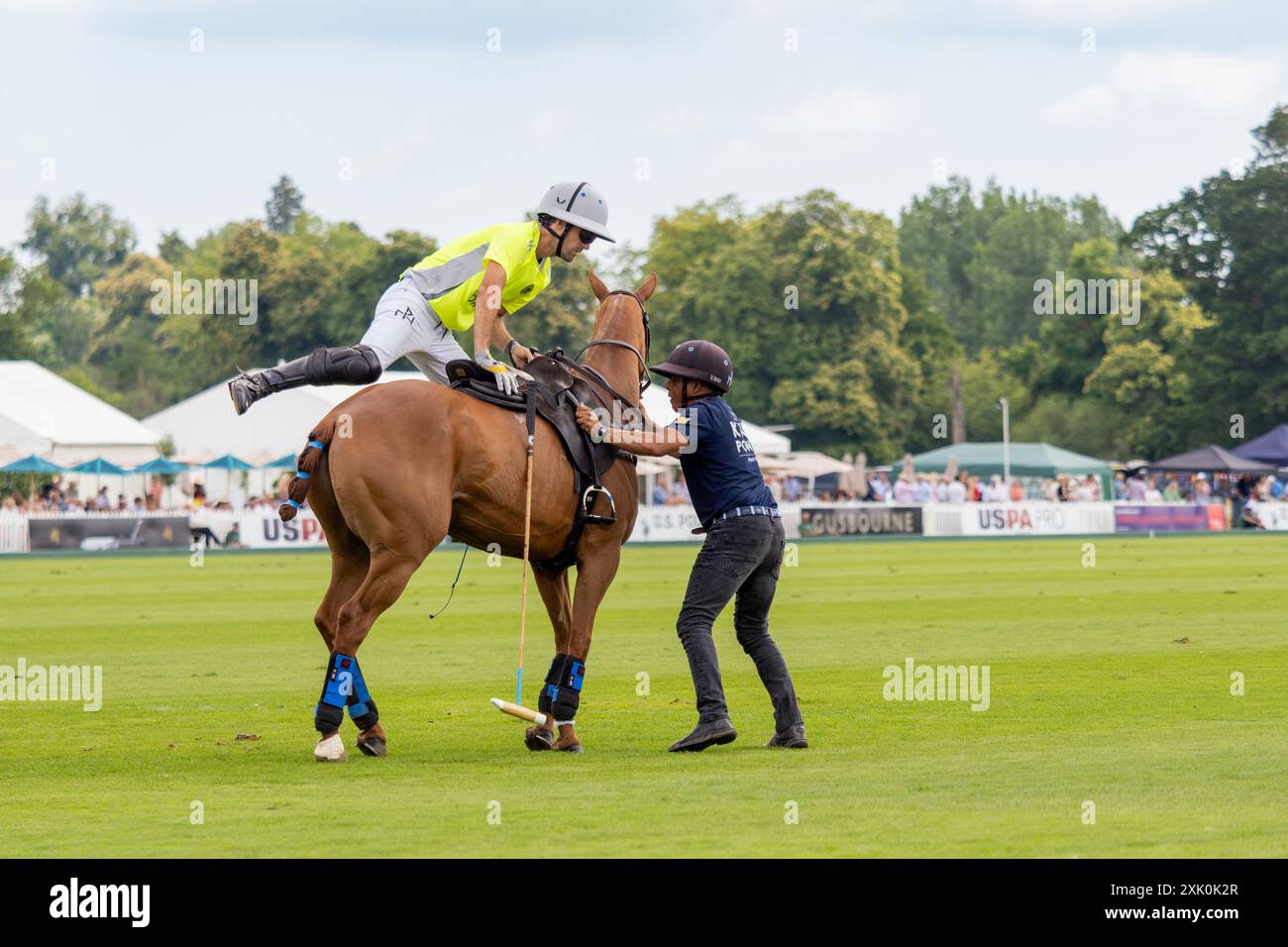A quick pony change at a competition of Polo, Cowdray park, England ...