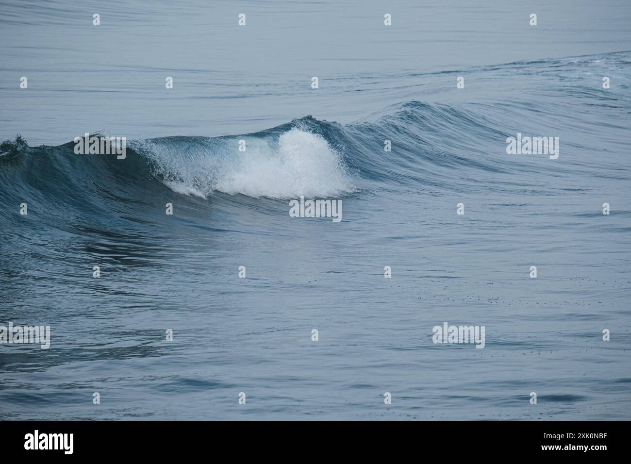 Rolling breaking waves Stock Photo - Alamy
