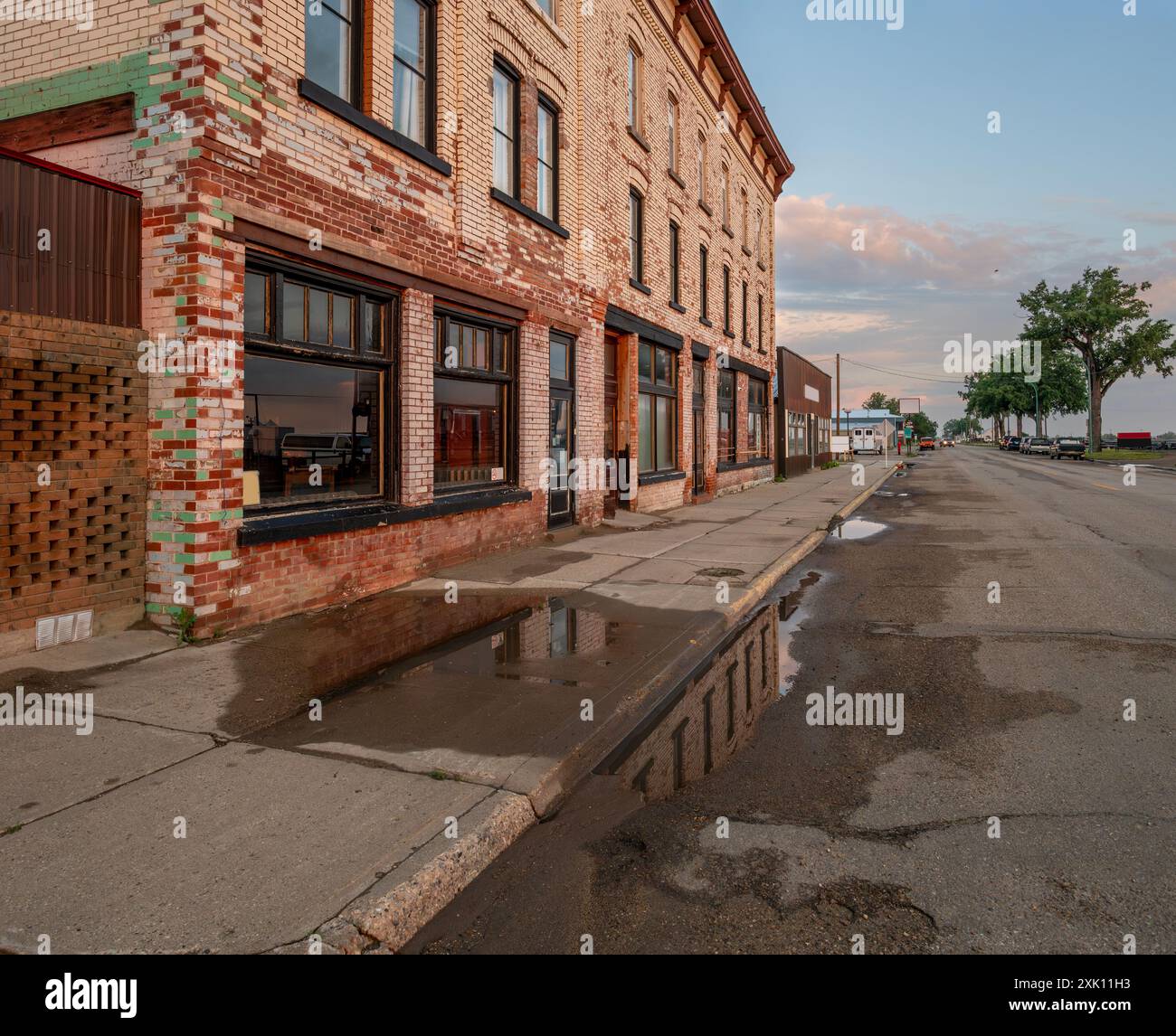 Old abandoned brick building on a street in the town of Maple Creek ...