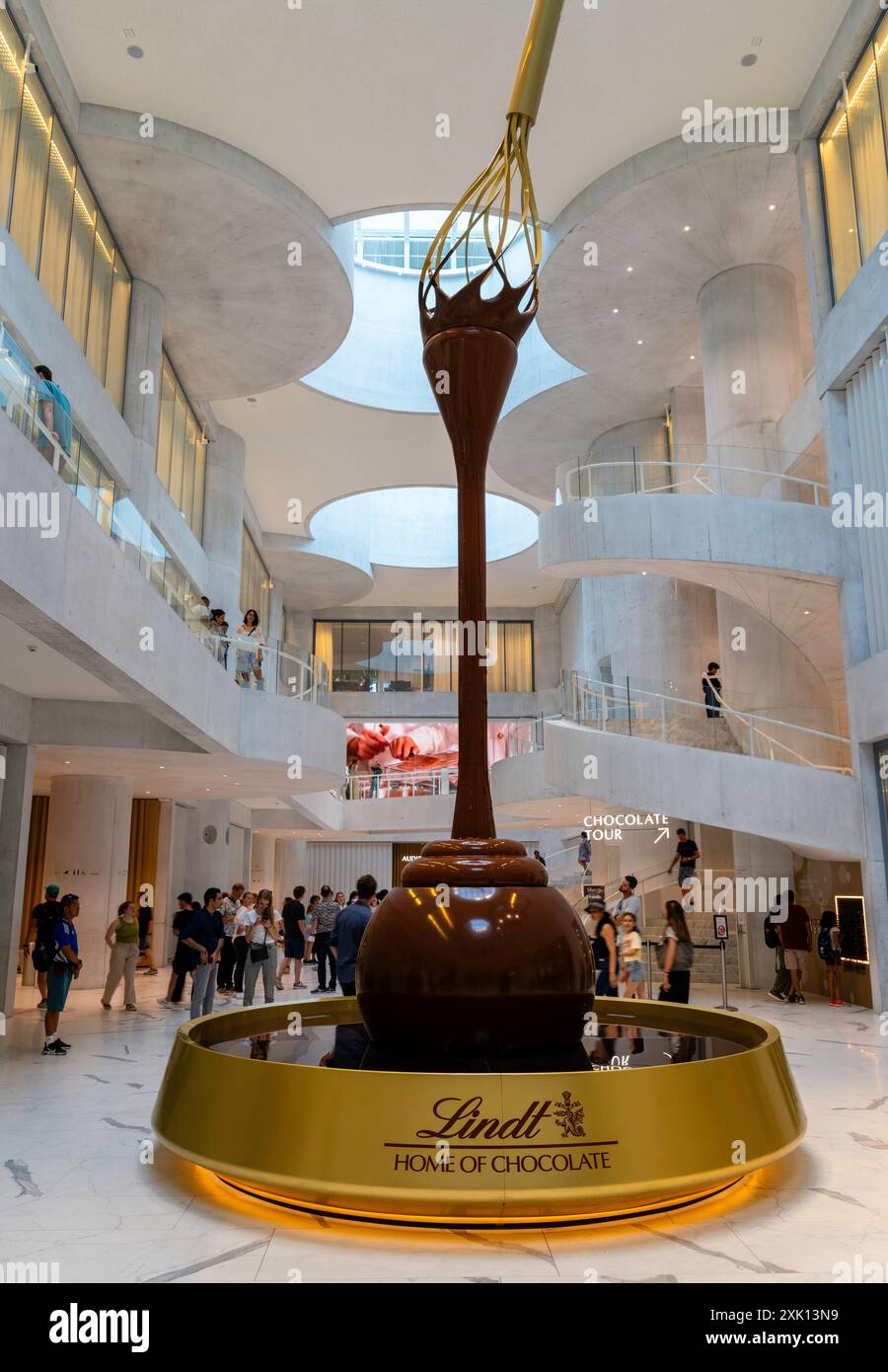 Tourists explore the Lindt Chocolate Factory, Kilchberg, Switzerland ...