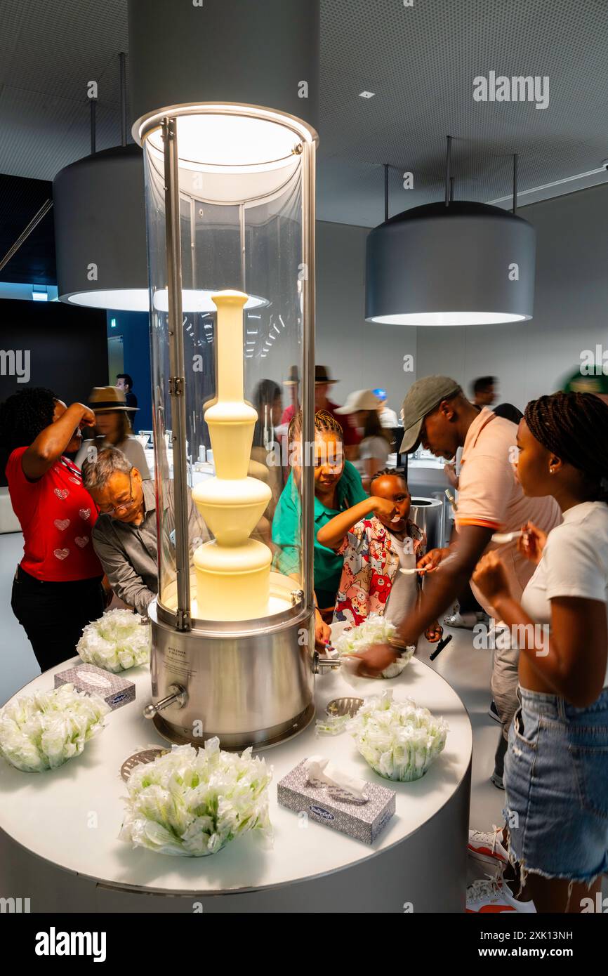Tourists explore the Lindt Chocolate Factory, Kilchberg, Switzerland ...