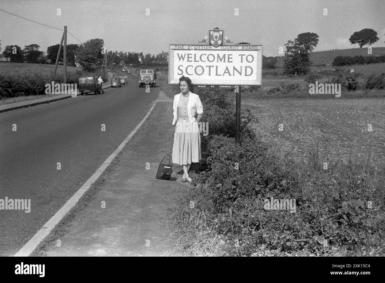 Gretna Green, Scotland. 1957 – A woman posing for a photograph in front ...