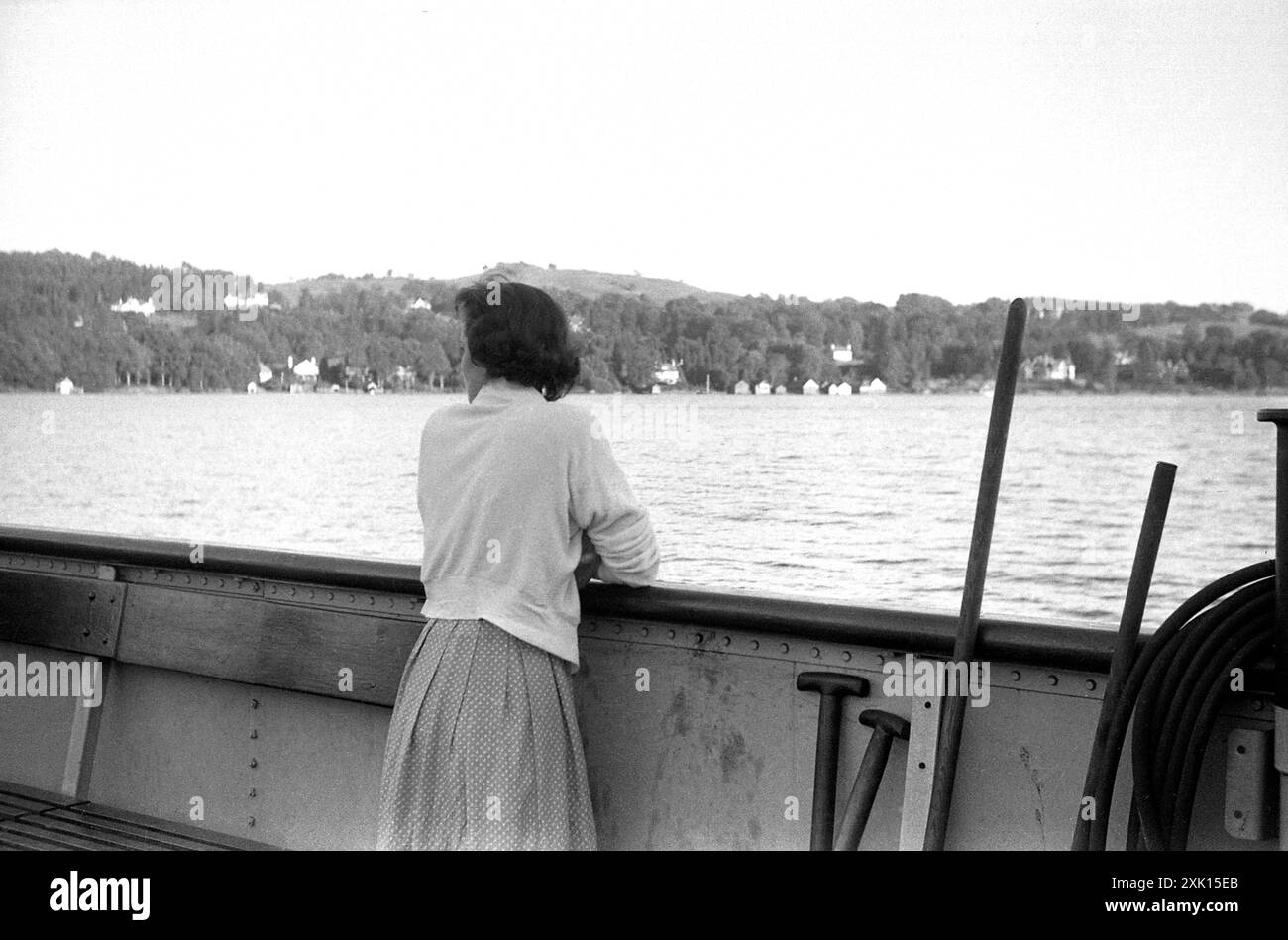Windermere, Cumbria. 1957 – A woman on board the Windermere Ferry which ...