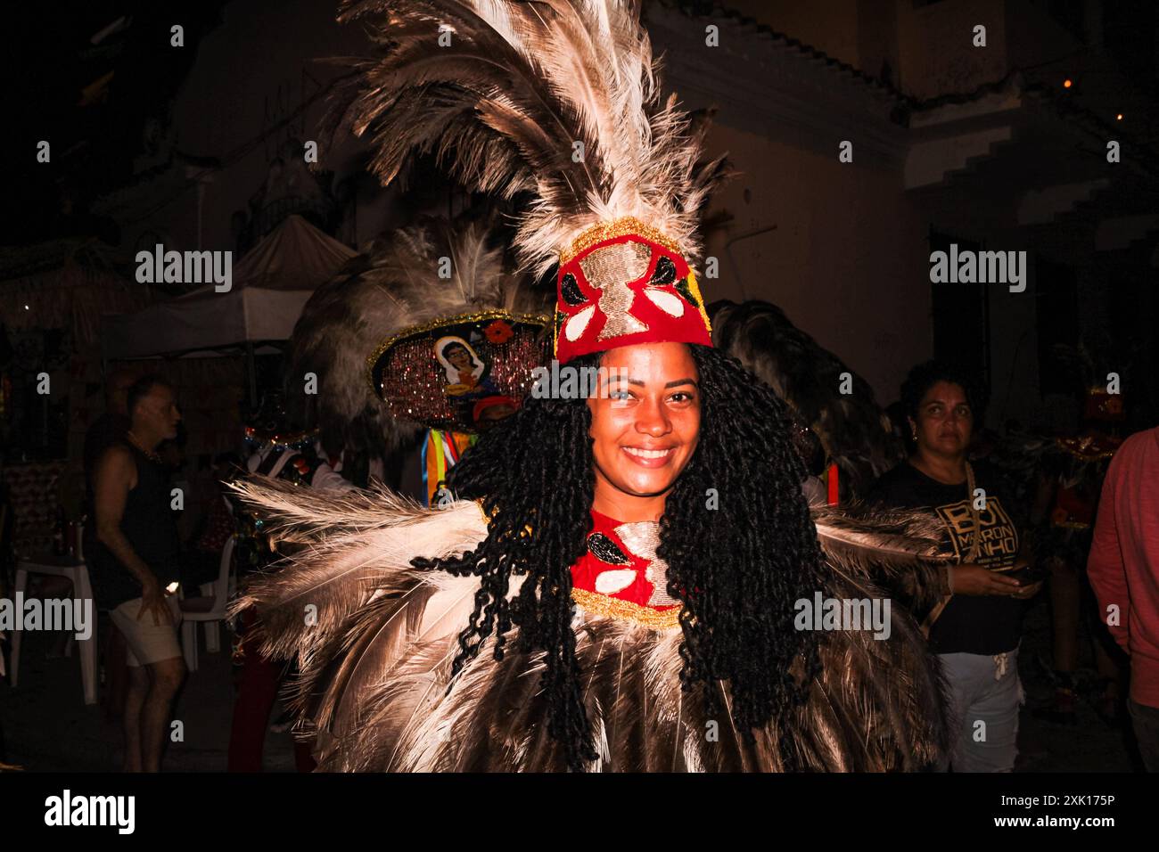 Ballerina, wearing a costume and headdress, decorated with beads and ...