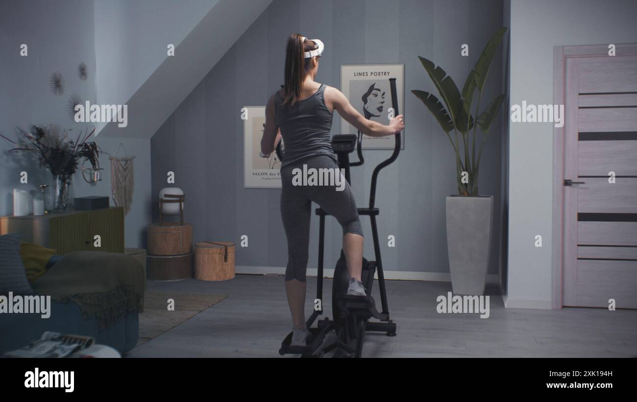Female athlete wearing virtual reality headset starts training on ...