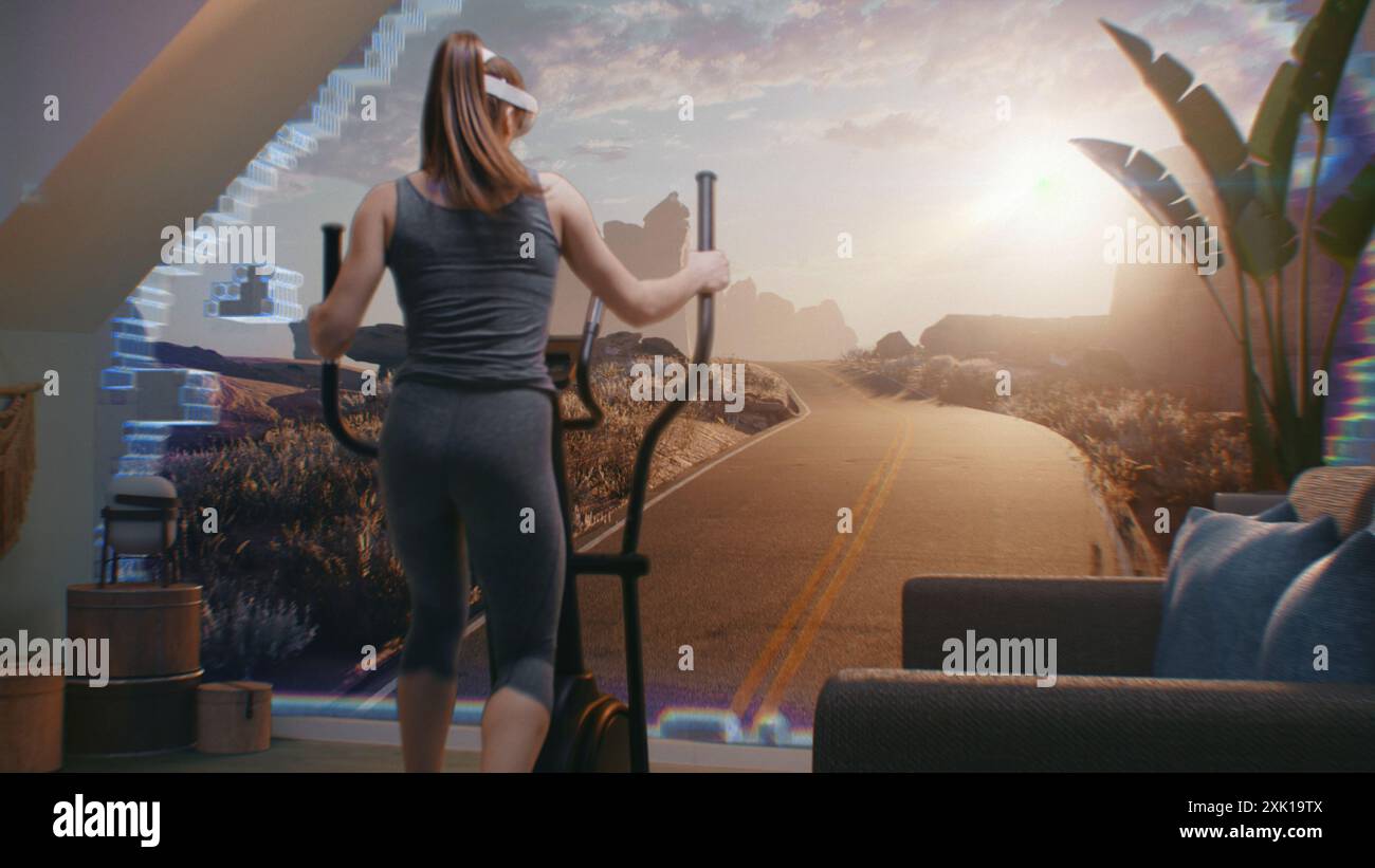 Female athlete wearing virtual reality headset trains on orbitrek ...